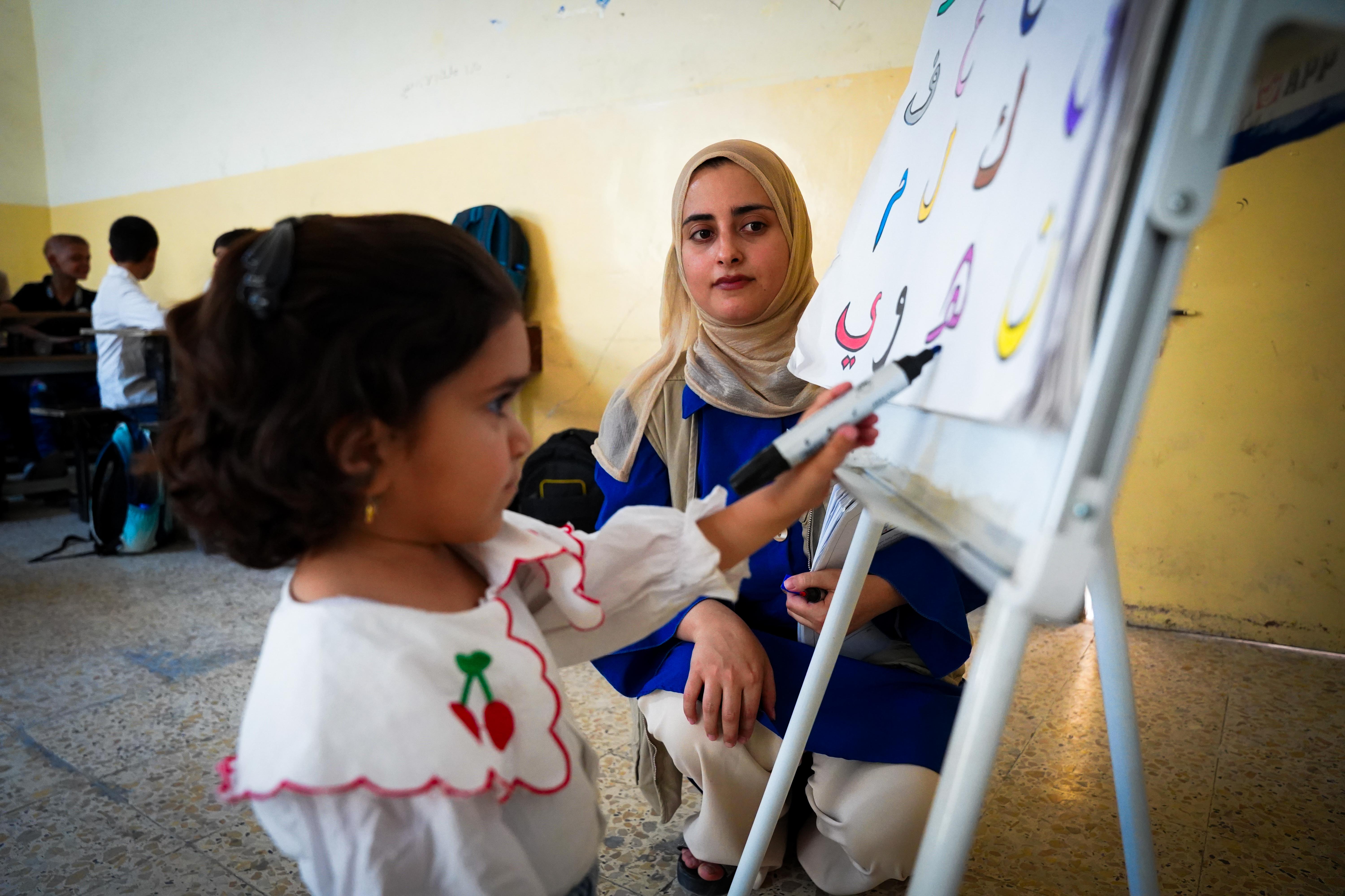 Fatma Finds Her Voice at the Writing Board | Iraq | World Vision ...