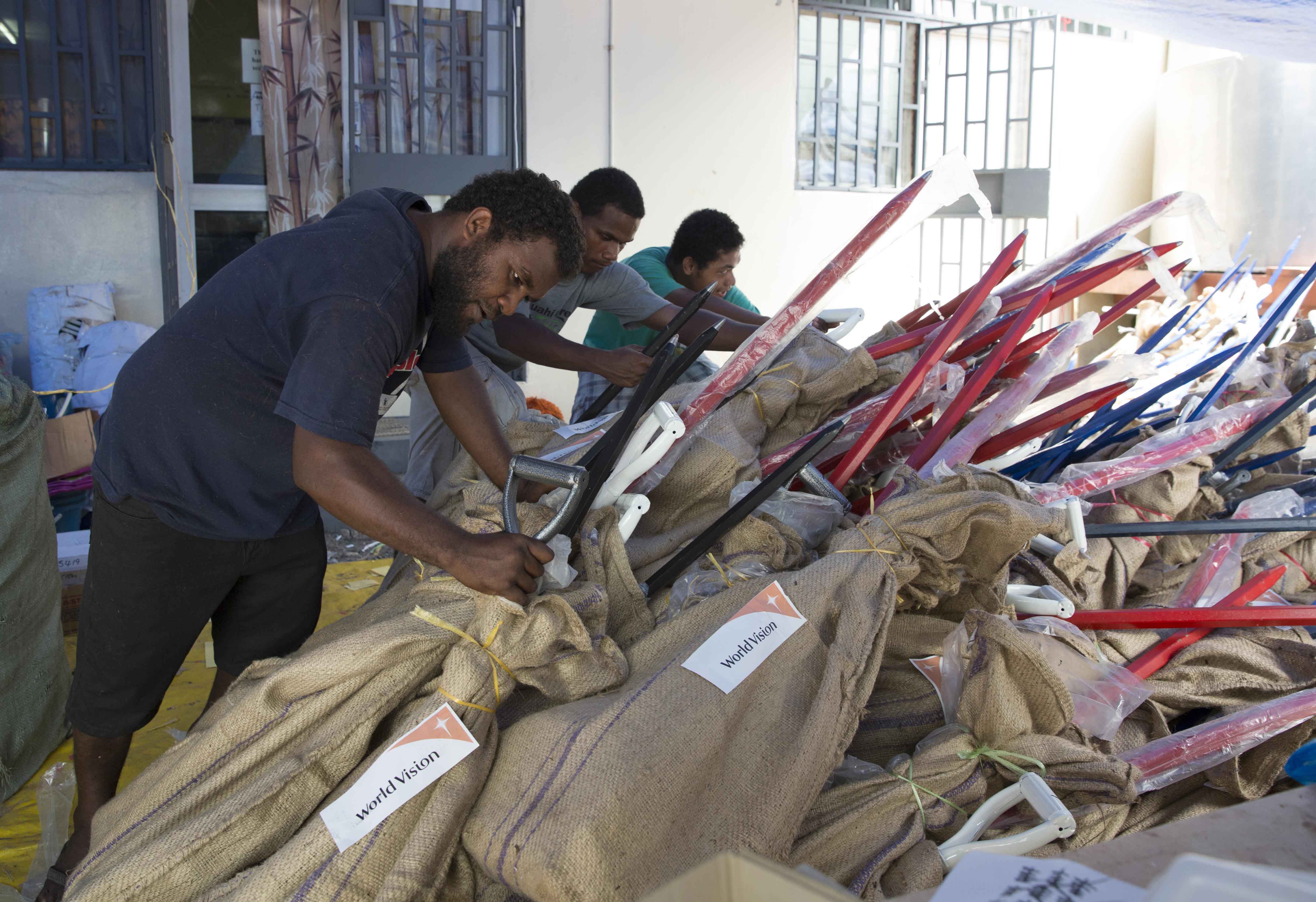 Volunteers pack relief items for flood affected families | Solomon ...