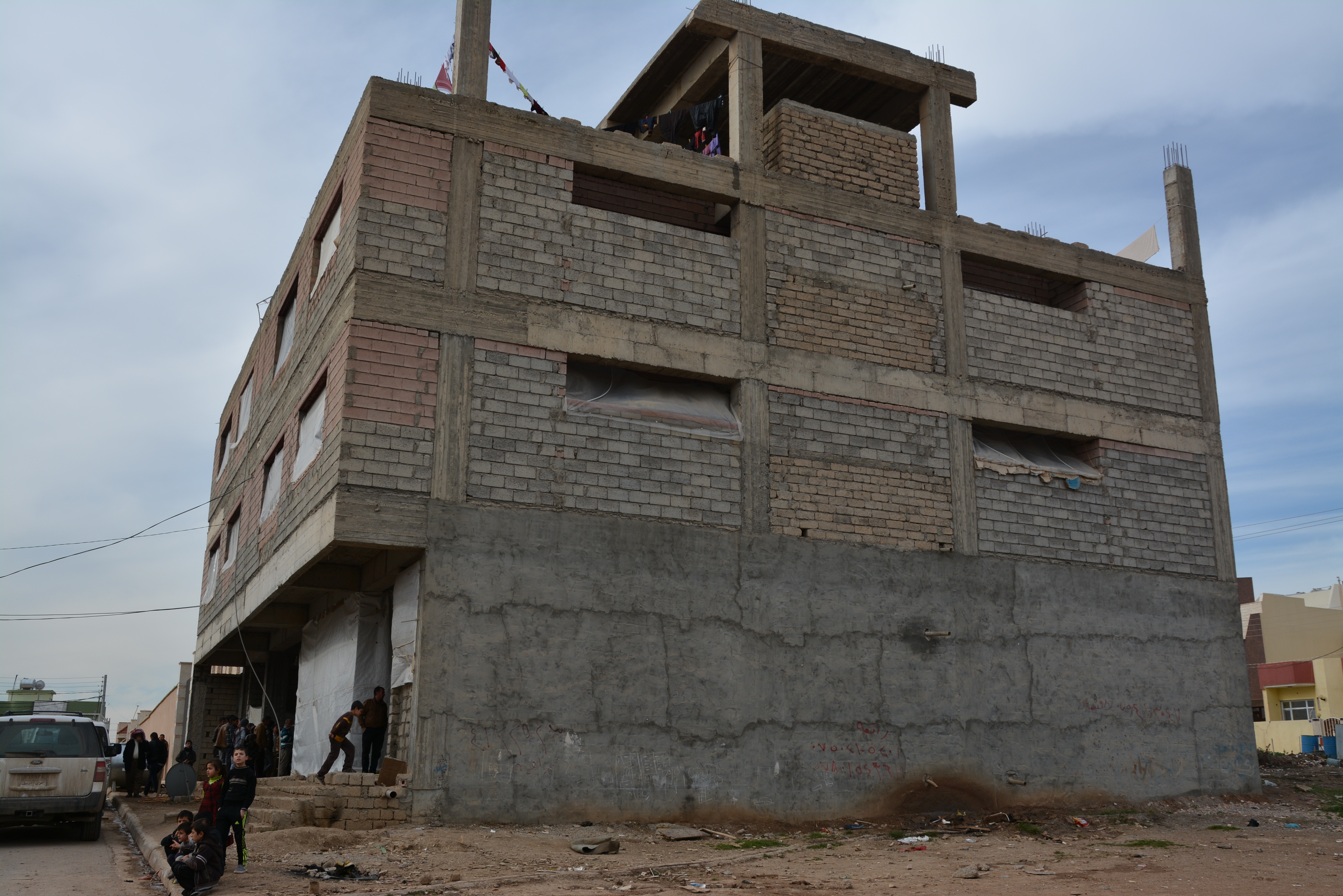 Displaced families find shelter in an empty office building | Syria ...