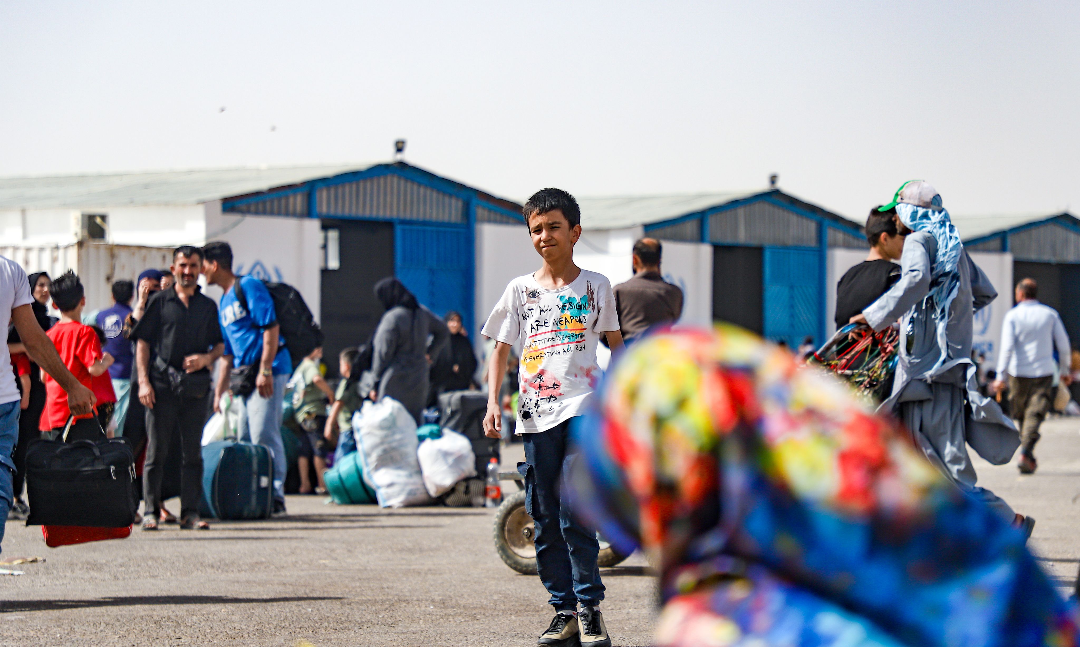 Inside the growing crisis of Afghan returnees at the Iran border ...