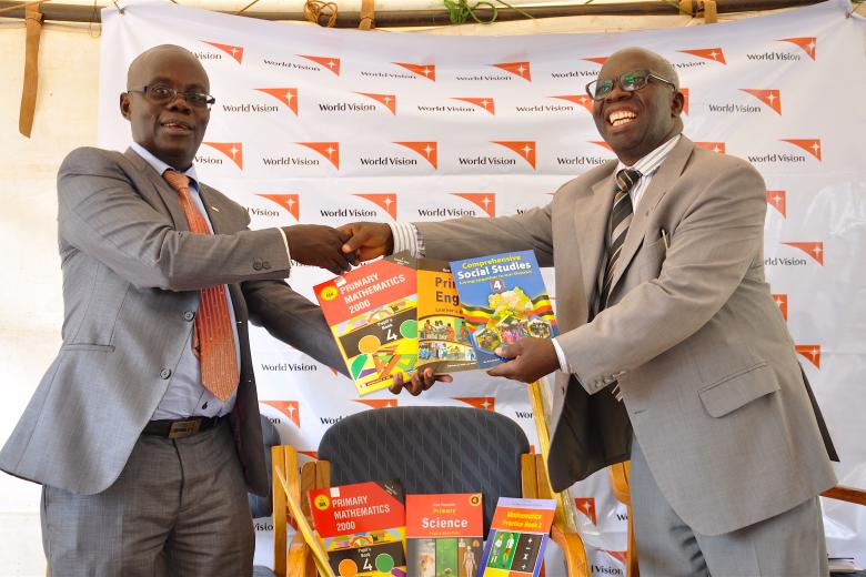 World Vision Uganda donates scholastic materials to 600 UPE schools ...